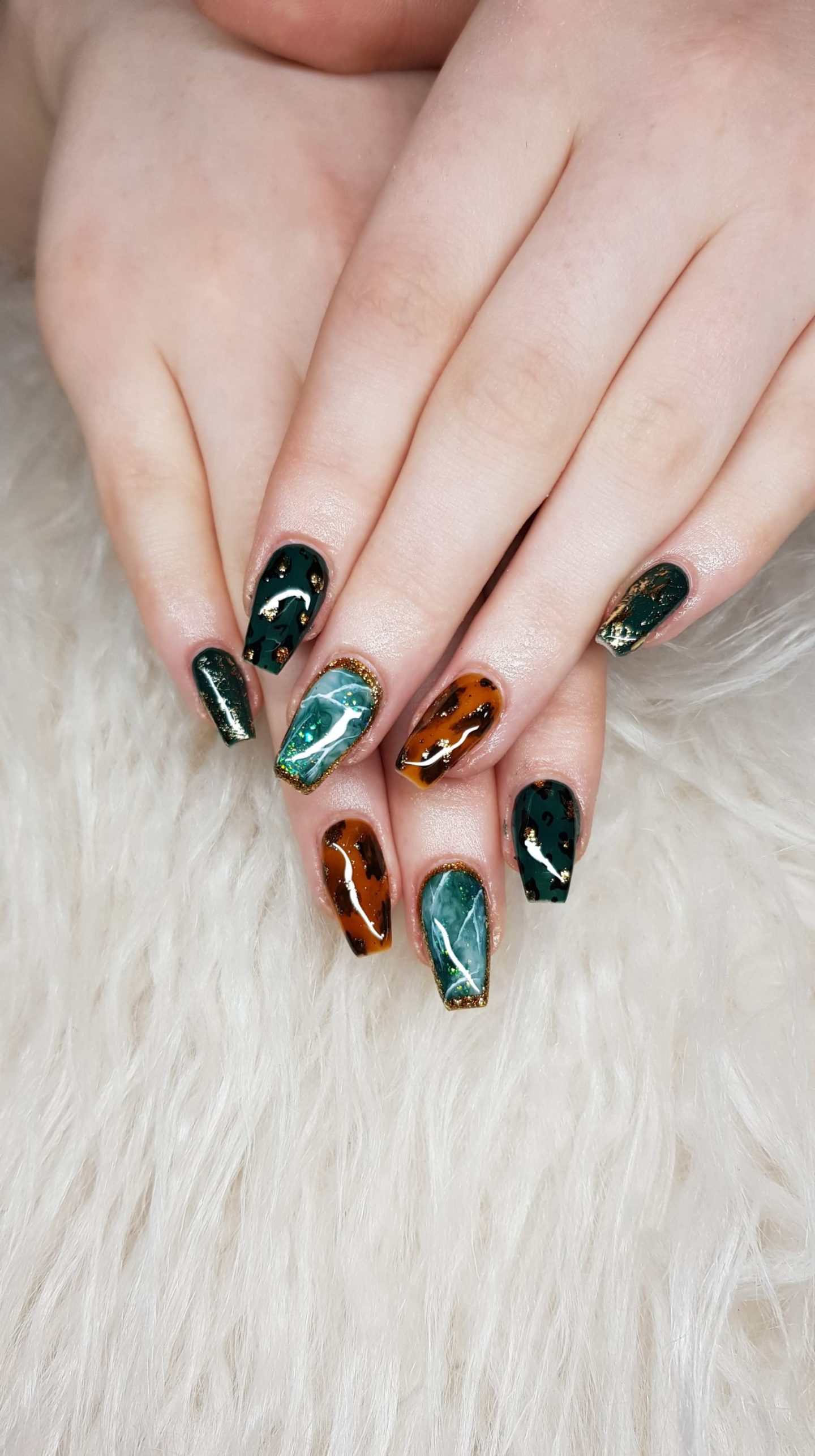 Tortoise shell and opal nails with gold accents for Christmas